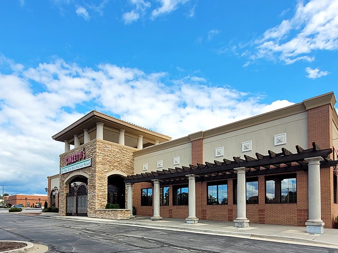 The stone facade of Cinzetti's stands like a Tuscan embassy in suburban Kansas, promising culinary diplomacy between Italy and the Midwest.