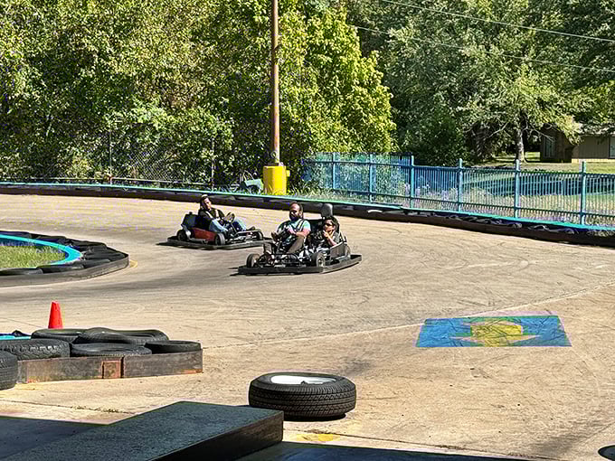 The winding track at Lokomotion beckons speed demons of all ages. Those red and blue barriers aren't just for show—they've caught many an overzealous driver with NASCAR dreams.