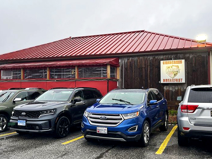The red roof of CCF Bayside beckons like a lighthouse for the hungry. Rustic wooden exterior with character that says "seafood secrets inside."