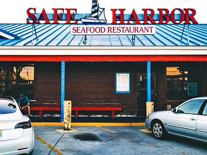 The blue roof and bold red signage beckon like a lighthouse for hungry souls. Simplicity on the outside, seafood magic within.