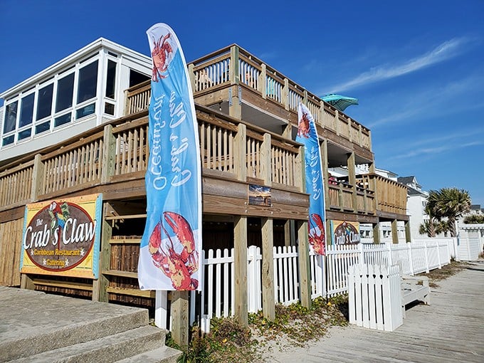 The entrance to paradise isn't pearly gates, but red stairs flanked by tiki totems and colorful flags announcing your arrival at seafood heaven.