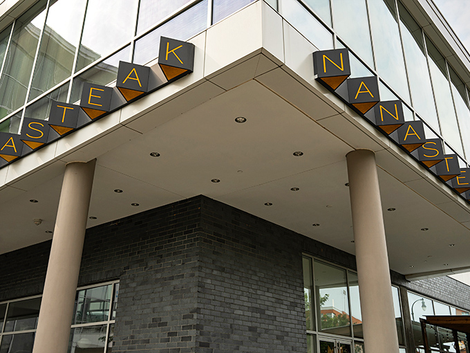 NanaSteak's illuminated sign beckons like a lighthouse for hungry souls wandering the streets of Durham, promising salvation in steak form.