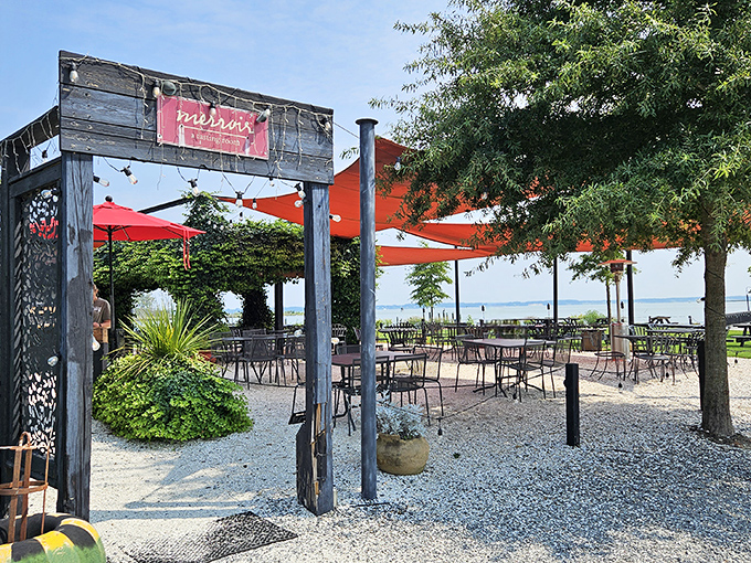 Merroir's unassuming exterior belies the culinary magic within. Those orange umbrellas aren't just for shade&mdash;they're beacons guiding seafood pilgrims to paradise.