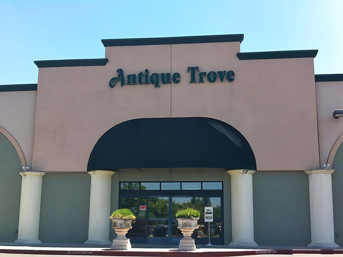 The stately fa&ccedil;ade of Antique Trove beckons with its elegant green awnings, promising treasures within that IKEA could never dream of offering.