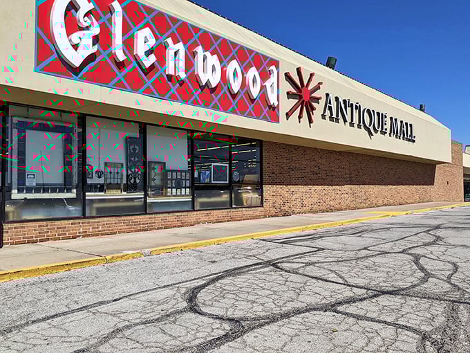 The iconic red and blue sign of Glenwood Antique Mall stands as a beacon to treasure hunters. Like a portal to the past, this unassuming exterior hides a universe of wonders within.