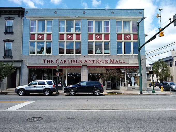 The iconic blue facade of The Carlisle Antique Mall stands proudly on Hanover Street, a time capsule waiting to be explored. 