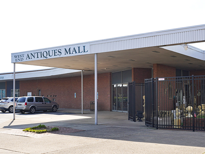 The unassuming brick exterior of West End Antiques Mall belies the wonderland of treasures waiting inside. Like a time-travel portal disguised as a 1970s department store.