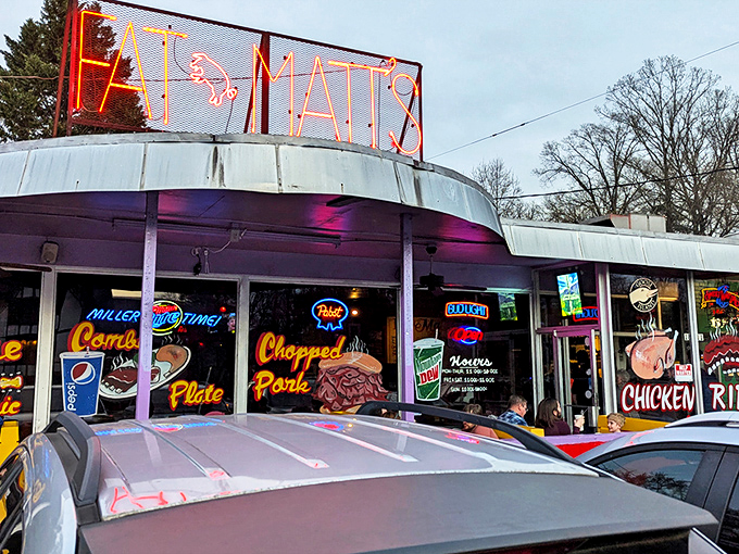 The iconic purple and red exterior of Fat Matt's stands like a BBQ beacon on Piedmont Avenue. Those neon signs aren't lying about what awaits inside.