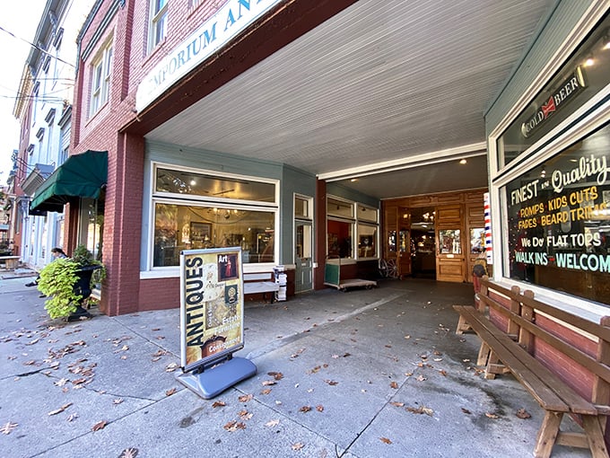 The brick facade of Emporium Antiques beckons like a time portal on Frederick's historic street. Vintage lampposts add that perfect nostalgic touch.