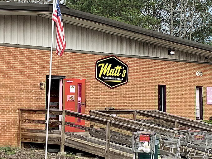 The unassuming brick fa&ccedil;ade of Matt's Warehouse Deals hides a treasure trove within, like finding the secret entrance to bargain paradise.