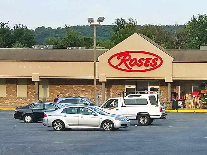 The iconic red Roses sign beckons bargain hunters like a retail lighthouse guiding ships to shore. Treasure awaits inside! 