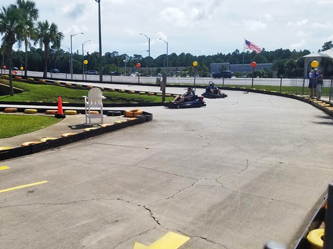 Racing around the bend, these go-karters experience that perfect moment when childhood joy meets adult competitive spirit. Those colorful tires aren't just for show&mdash;they're dream cushions for wannabe NASCAR stars.