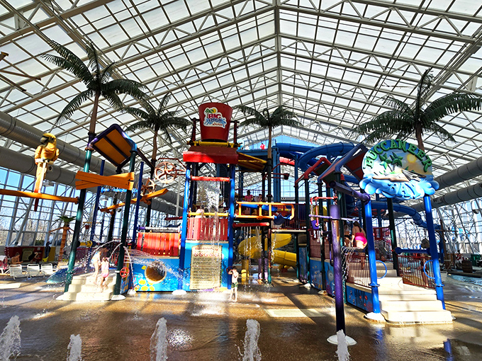 The indoor tropical paradise where winter goes to die. Colorful water structures and artificial palm trees create a mirage of summer under a cathedral of glass.
