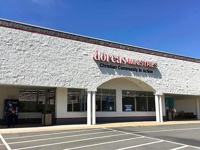 The welcoming façade of Dorcas Ministries invites treasure hunters with its clean white exterior and clear signage about donation procedures and store hours.