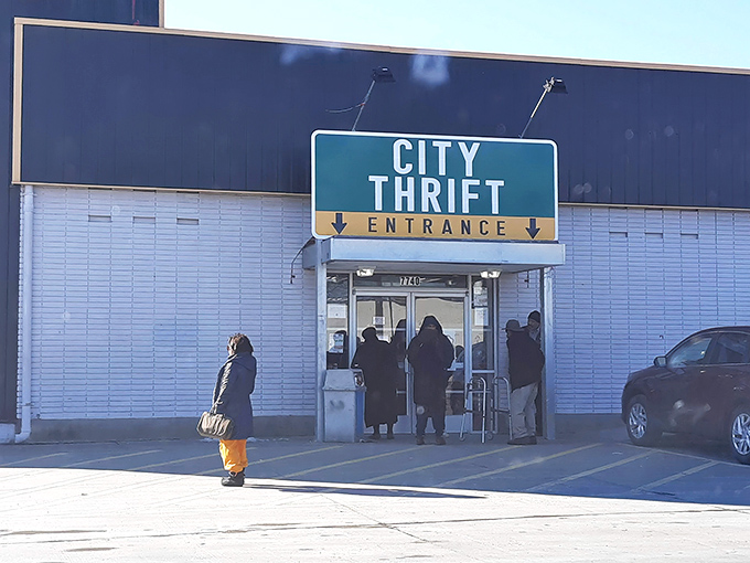 The iconic black and white exterior of City Thrift Waldo stands like a beacon for bargain hunters, complete with festive pennant flags that seem to whisper, "Treasures await inside!"