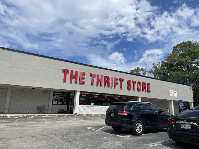Welcome to bargain paradise! The Thrift Store's bold red letters promise a treasure trove of secondhand wonders waiting to be discovered inside.