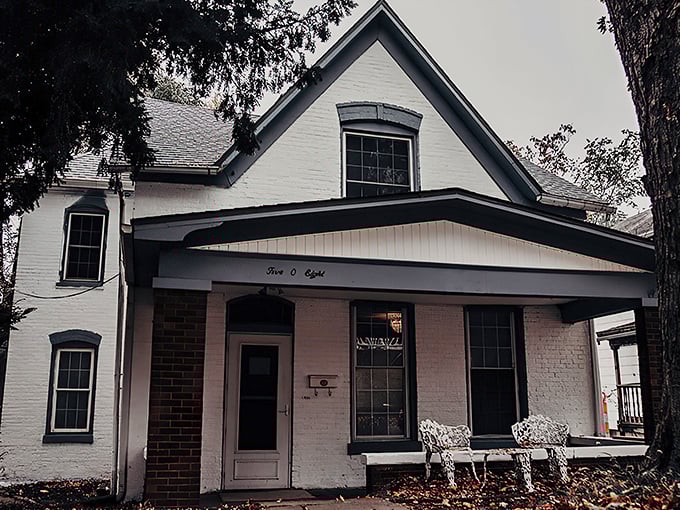 The unassuming facade of the Sallie House belies its reputation as one of America's most haunted locations. Those white walls have stories to tell.