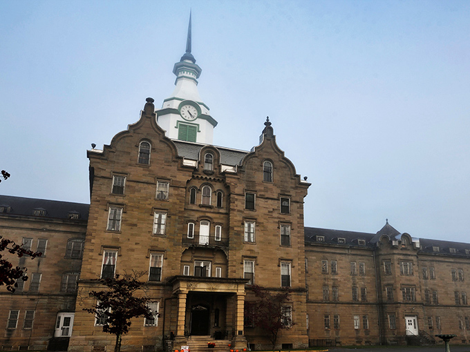 Antique medicine bottles line wooden shelves, silent witnesses to treatments once considered cutting-edge. Each glass vessel tells a story of psychiatric care's troubling evolution. 