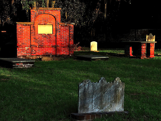 Spanish moss drapes over ancient brick structures like nature's funeral veil, creating an atmosphere that's both serene and slightly spine-tingling.
