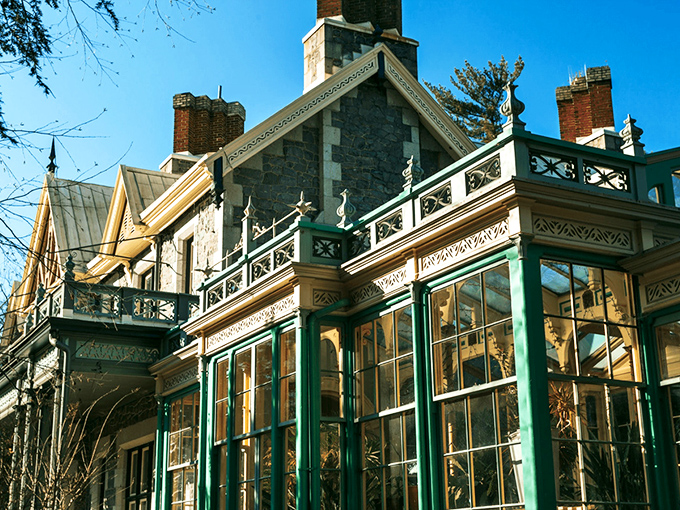 The mansion glows amber against the twilight sky, its stone fa&ccedil;ade and pointed gables silently whispering tales from another century. Like a Victorian ghost story come to life.