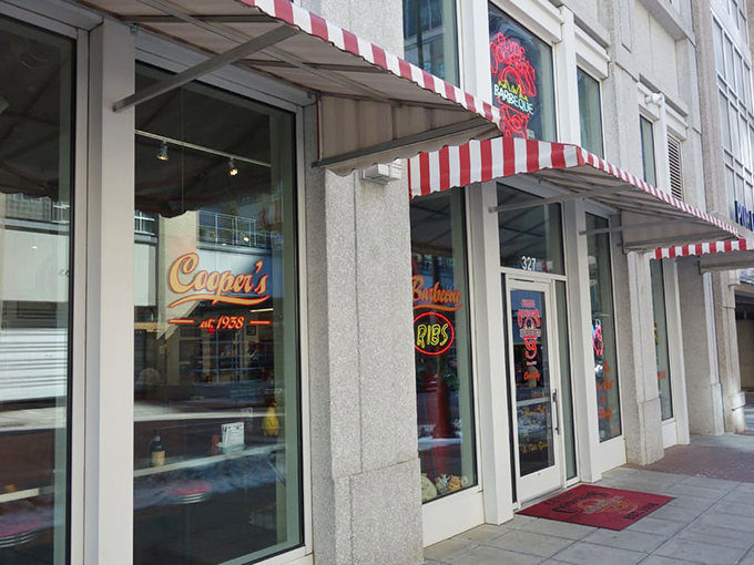 The iconic red awning and pig statue welcome you to Clyde Cooper's, where that neon sign has been promising barbecue bliss since FDR was president.