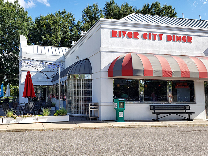 Art deco meets comfort food heaven in this retro-styled exterior. The blue awnings and vintage signage promise a time-traveling culinary adventure. 