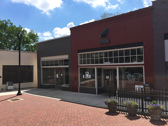 The vibrant red brick exterior of Old Black Bear Brewing Company stands as Madison's beacon for craft beer enthusiasts and root beer pilgrims alike.