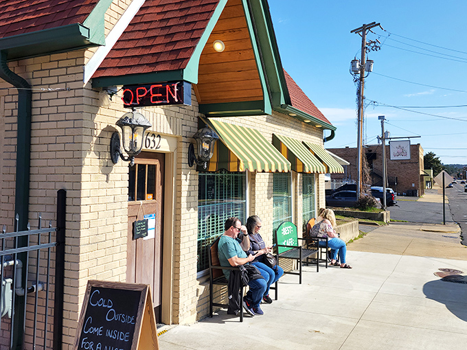 The charming cream brick exterior of Best Cafe & Bar feels like a time capsule of Hot Springs history, complete with those classic green awnings.