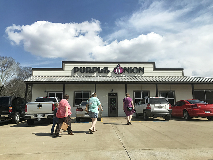 The Purple Onion's exterior beckons with its playful signage &ndash; that giant purple bulb is basically saying, "Good food happens here, folks!"