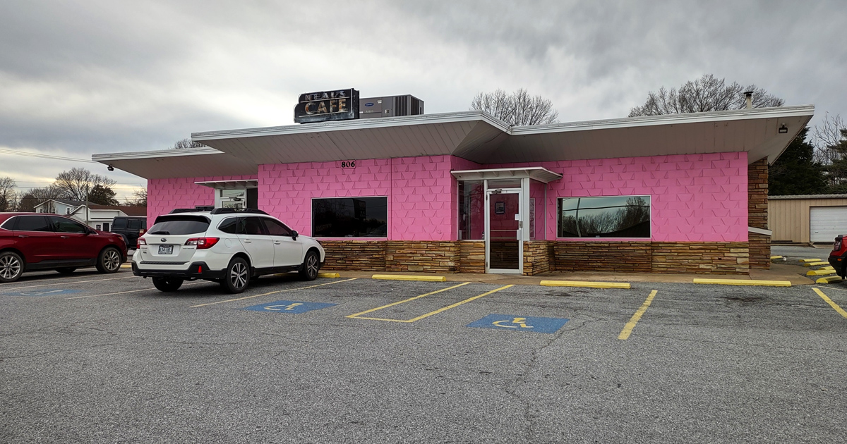 The pink palace of poultry stands proudly against the Arkansas sky, like a delicious mirage beckoning hungry travelers from miles around.