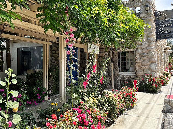 Stone by stone, this fairy tale fa&ccedil;ade promises culinary magic within. The blue door isn't just an entrance&mdash;it's a portal to France itself.