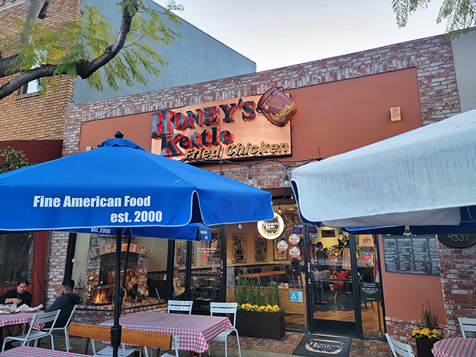 The brick-faced storefront with its iconic sign and blue awning promises what might be California's most perfect fried chicken experience.