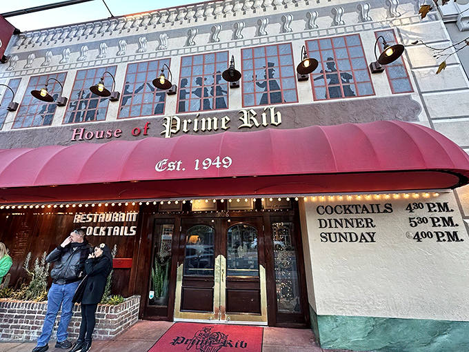 The iconic red awning beckons meat lovers like a carnivorous lighthouse on Van Ness Avenue, promising beef-filled dreams since 1949.