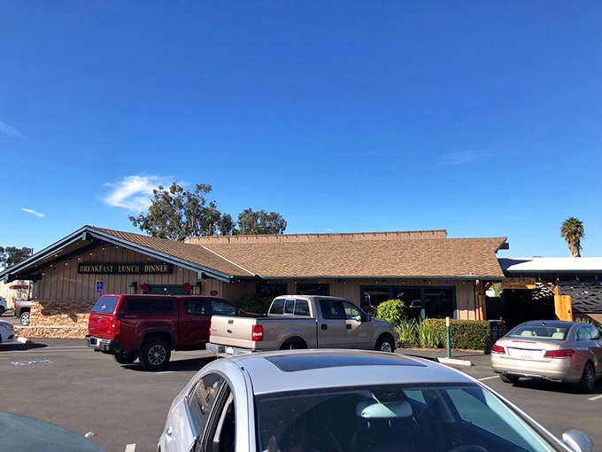 The unassuming exterior of D'Carlos hides culinary treasures within, like finding a diamond mine disguised as a garden shed.