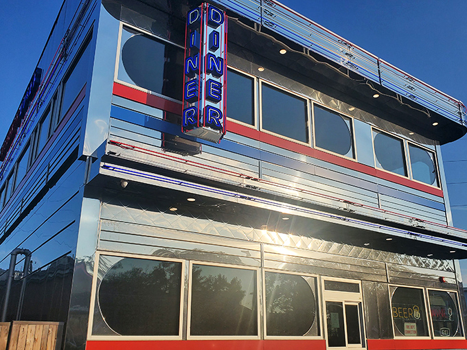 The gleaming chrome exterior of Goobers Diner shines like a beacon of breakfast hope, a retro time machine promising delicious nostalgia inside. 