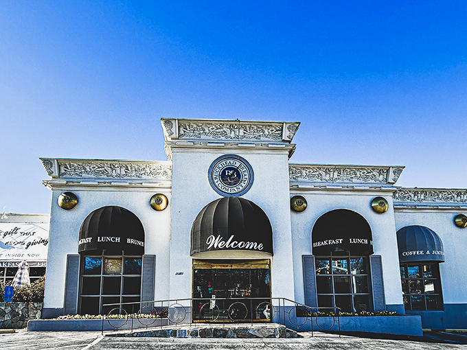 The elegant white facade of Corner Cafe stands like a culinary lighthouse in Buckhead, beckoning hungry Atlantans with promises of breakfast bliss.