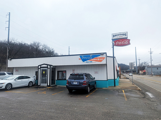 The unassuming exterior of Dagwood's Cafe stands as a beacon to breakfast lovers, its vintage turquoise trim and classic signage promising authentic diner delights within.
