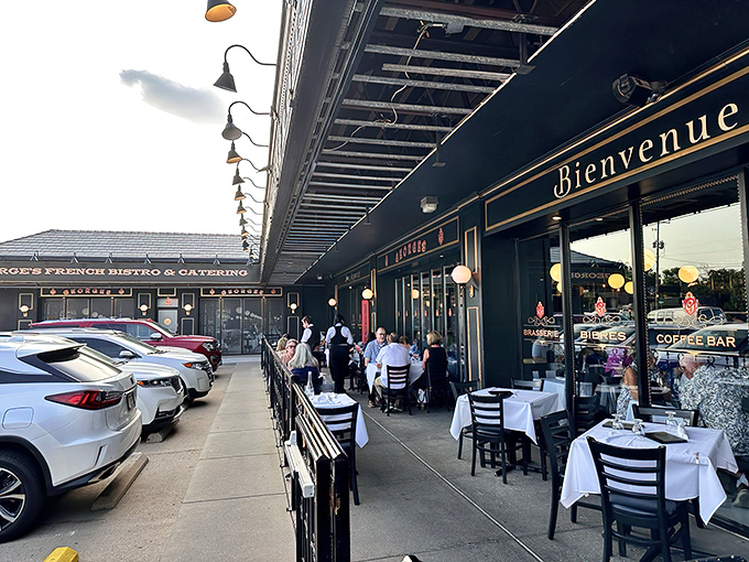 The black and gold fa&ccedil;ade of Georges French Bistro stands proudly against the Kansas sky, promising Parisian delights with Midwestern hospitality.