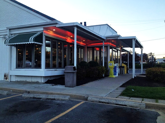 The classic white exterior of College Park Diner stands like a time capsule on Baltimore Avenue, its vintage sign promising comfort food salvation to hungry Marylanders.