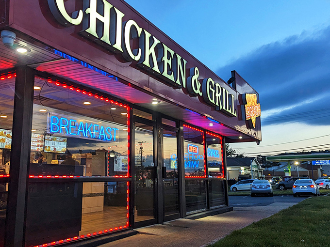The neon glow of Legends beckons like a lighthouse for the hungry, promising salvation in the form of perfectly fried chicken as dusk settles over Hyattsville.