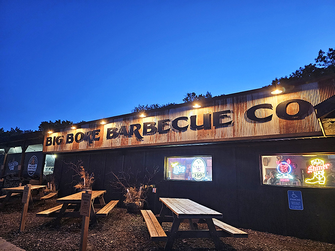 The weathered corrugated metal exterior of Big Bore Barbecue stands as a rustic beacon for meat lovers&mdash;industrial chic meets smokehouse authenticity.