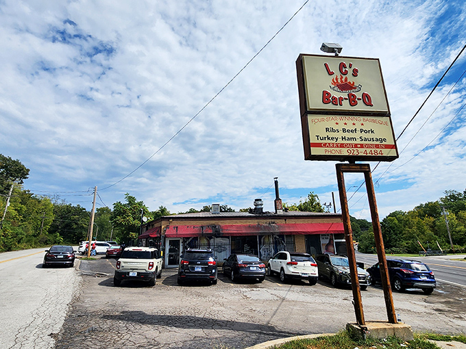 The unassuming exterior with its bright red awning houses barbecue magic that's drawn pilgrims from across Missouri for decades.