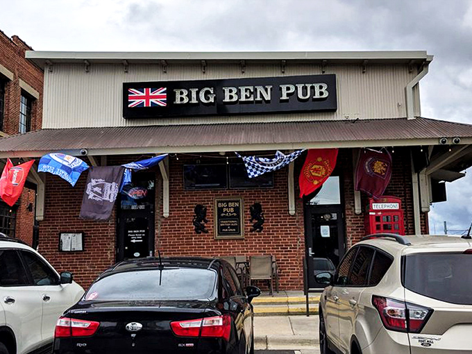 The Union Jack proudly announces your arrival at Big Ben Pub, where those magnificent wooden doors might as well be a portal straight to London. 