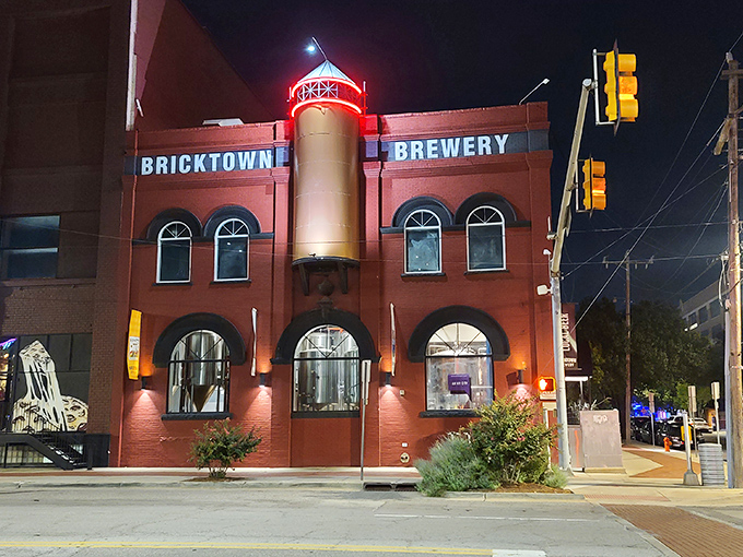 The iconic red brick exterior of Bricktown Brewery stands as a beacon of culinary promise in Oklahoma City's historic district, where industrial charm meets modern appetite.