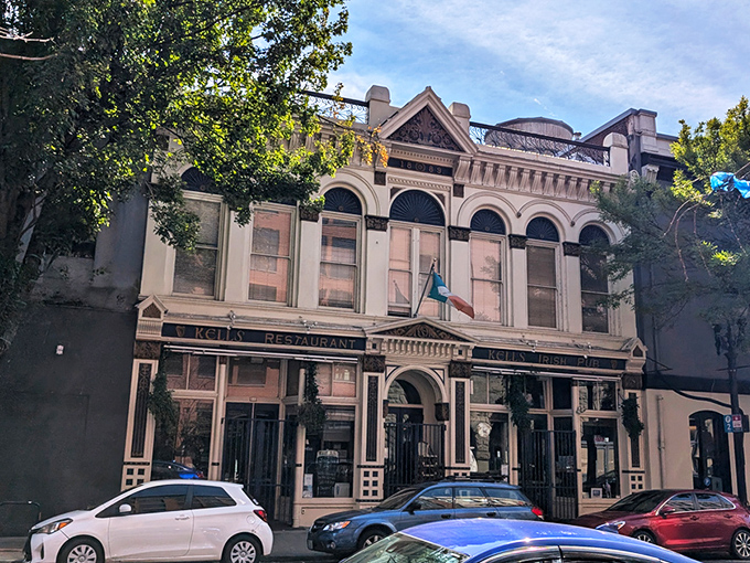 The historic fa&ccedil;ade of Kells stands proudly in Portland, complete with Irish flag and inviting blue umbrellas beckoning passersby to step into Dublin-on-the-Willamette. 