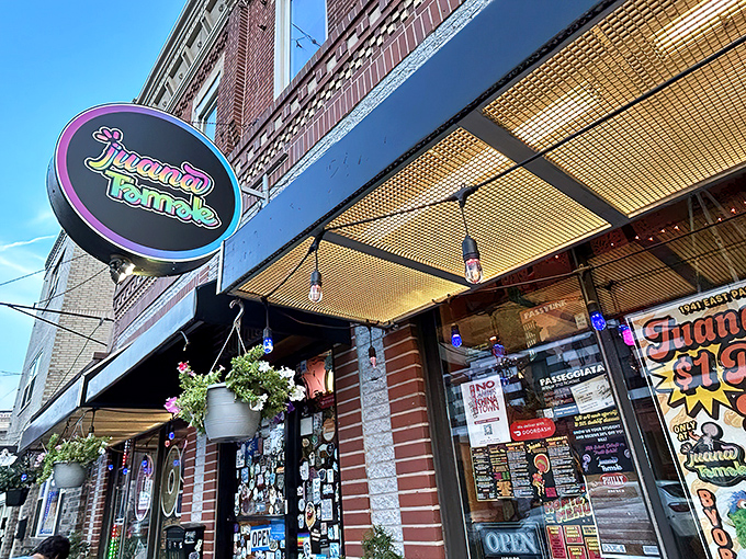 The colorful storefront of Juana Tamale beckons like a fiesta waiting to happen. Mexican flags and vibrant signage promise authentic flavors on East Passyunk Avenue. 