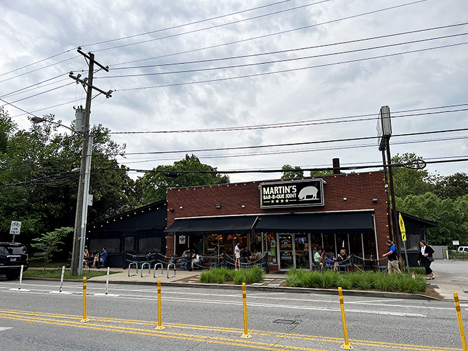 The red brick exterior of Martin's Bar-B-Que Joint beckons hungry pilgrims with its no-nonsense fa&ccedil;ade and the promise of smoky delights within.