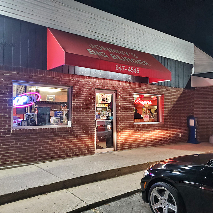 The iconic red awning of Johnny's Big Burger glows like a beacon for hungry travelers. This unassuming brick building houses burger greatness that locals have treasured for decades.