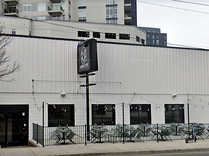 The unassuming white exterior of Marble Fox Brewing Company stands like a blank canvas, hiding the flavor explosion waiting inside. Nashville's best-kept liquid secret.