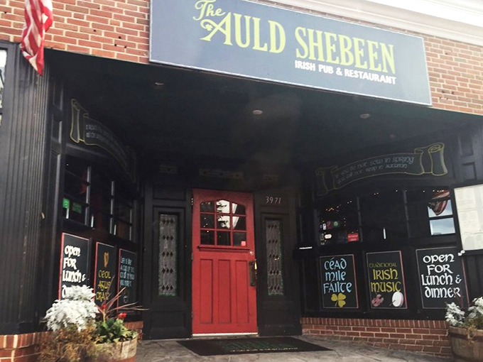 The brick facade of The Auld Shebeen stands proudly on Fairfax's Main Street, American and Irish flags waving in harmony like old friends sharing stories.